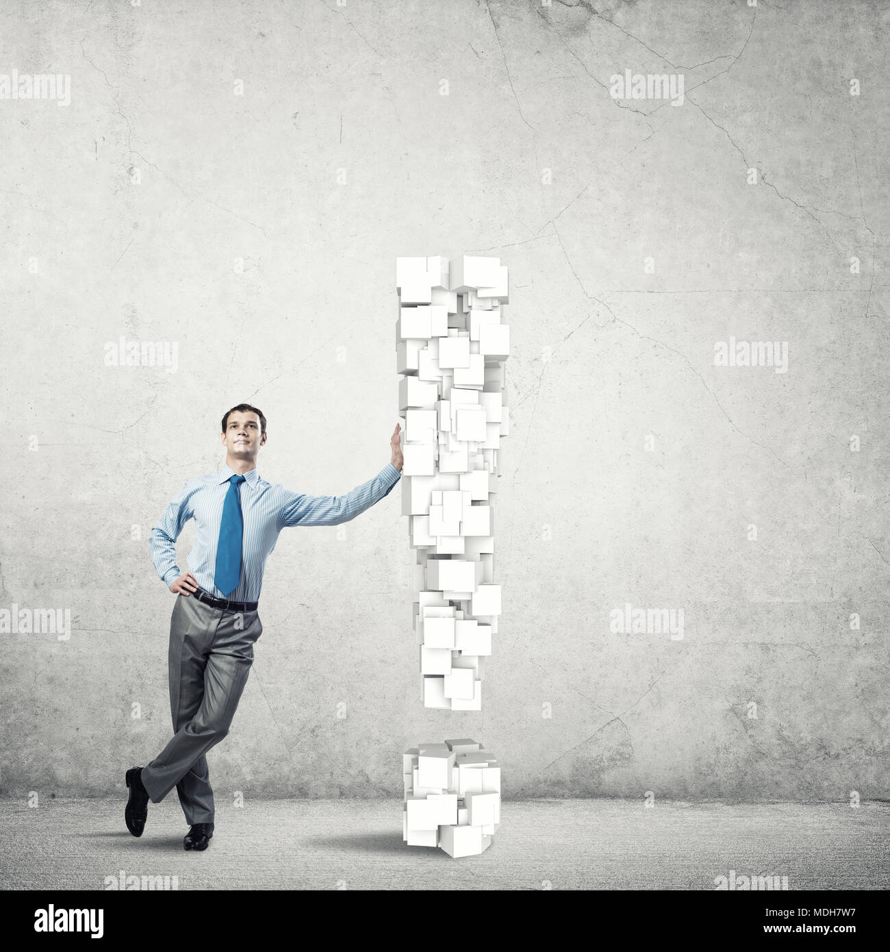 Man and big attention sign Stock Photo - Alamy