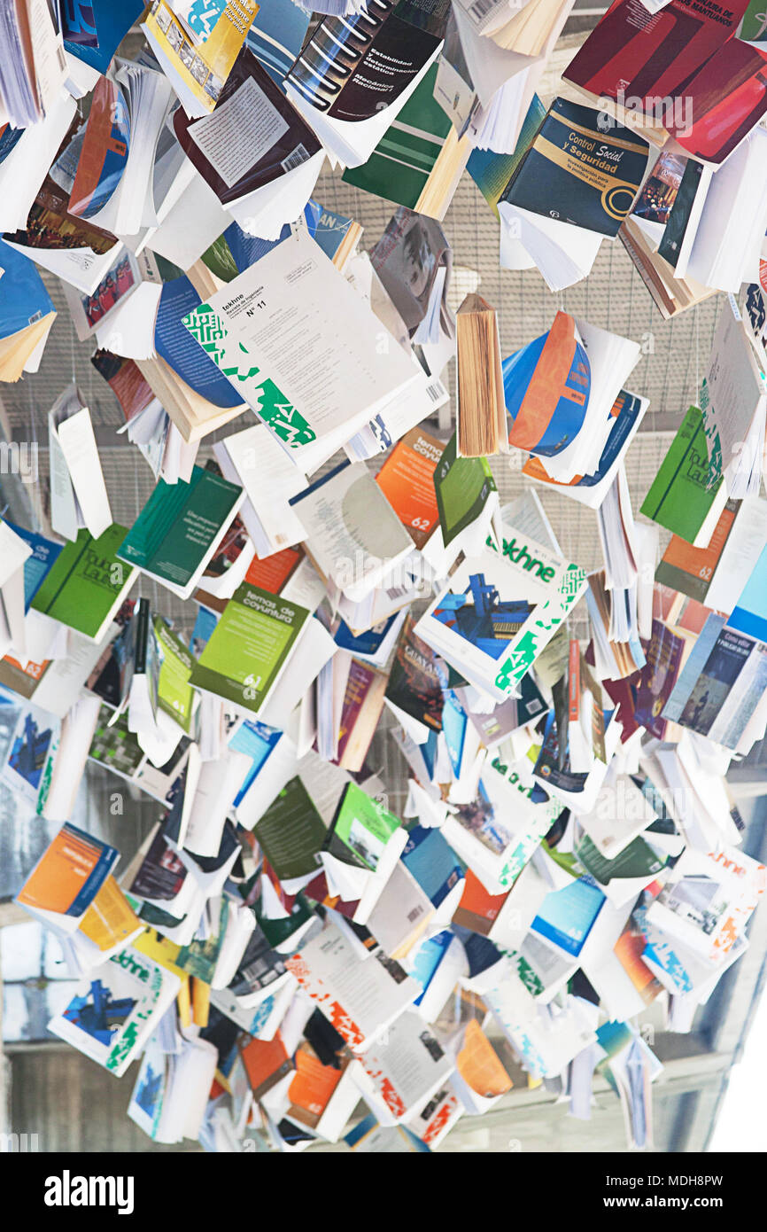 Many Books together. A pile of books hanging from the ceiling at ...
