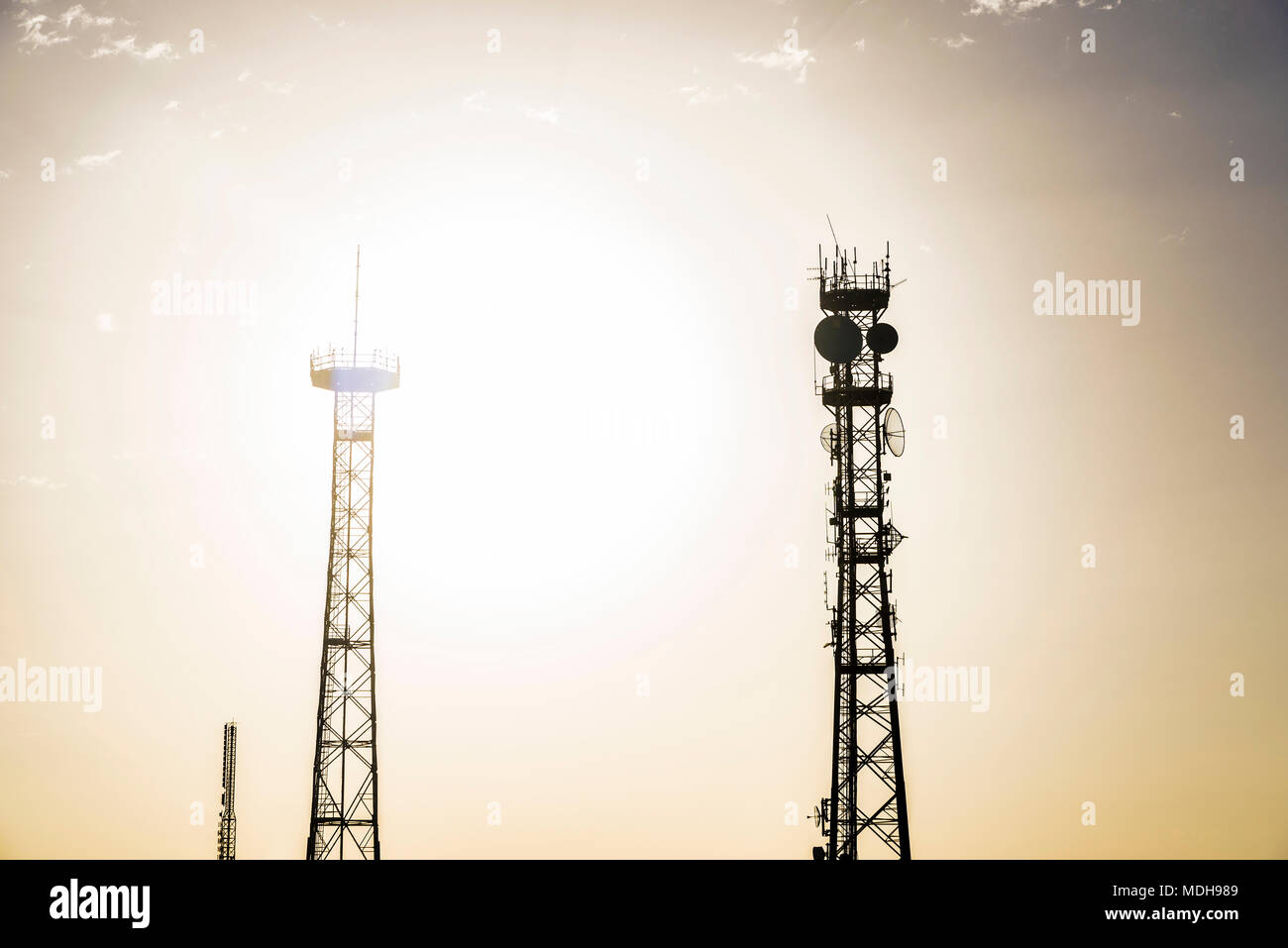 Silhouettes of telecommunications towers at sunset in Erice in Sicily ...