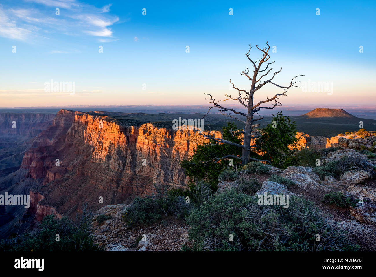 An extinct volcano near the edge of the Grand Canyon at sunset and a ...