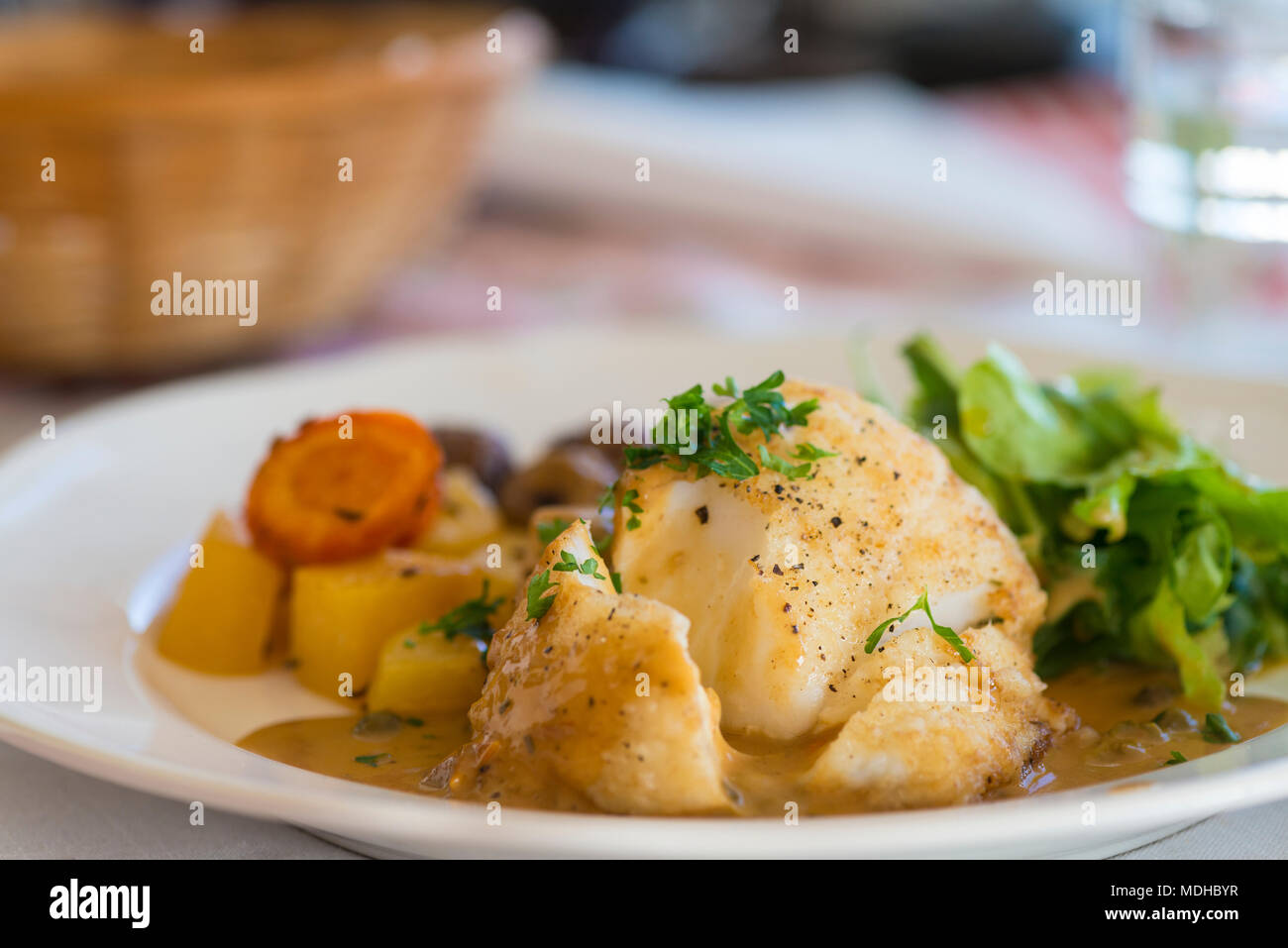 Cod dinner on a plate, Langaholt, Iceland Stock Photo - Alamy