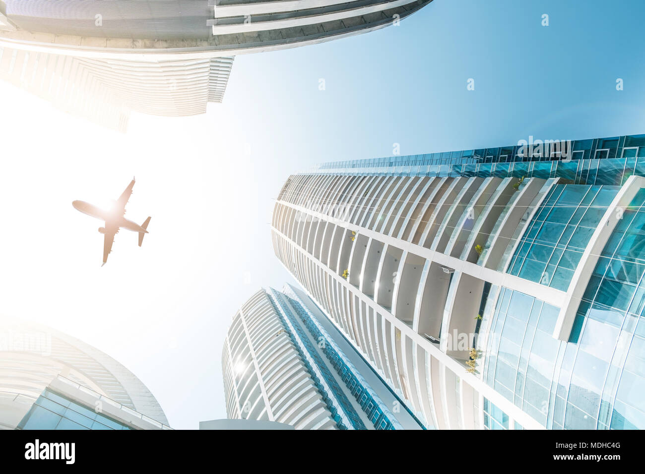 office building / modern skyscraper buildings, sky and airplane Stock ...