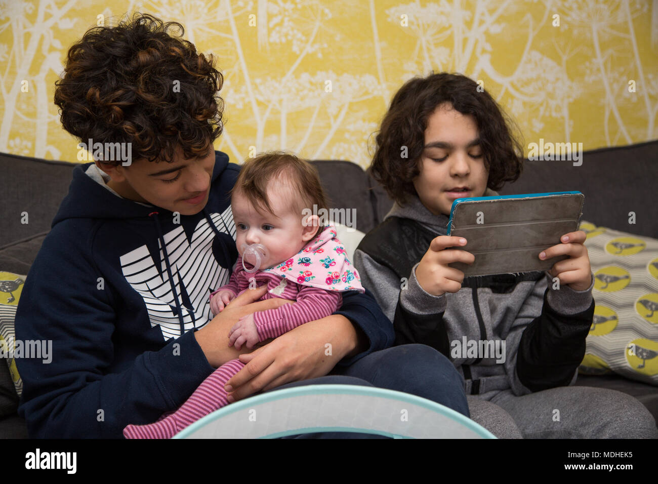 Teenager babysitting sister hi-res stock photography and images - Alamy