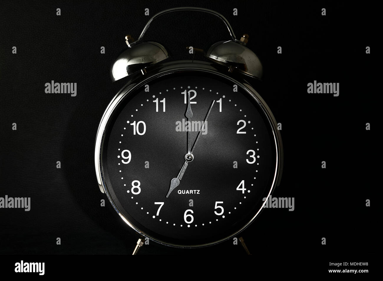 Old retro alarm clock with the hands set to 7:00 am or pm Stock Photo ...