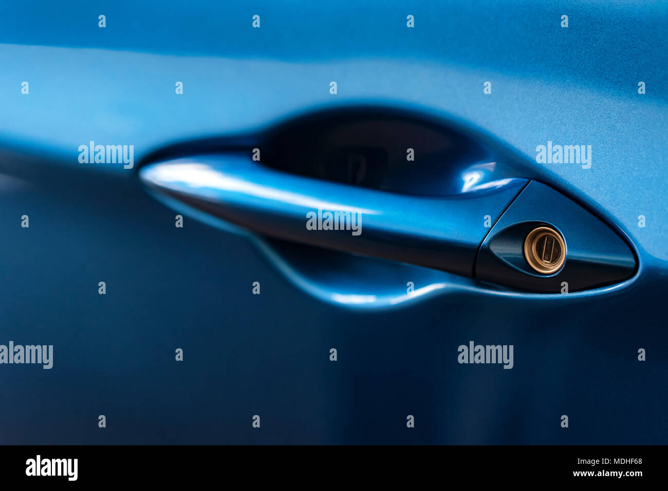 Modern blue car door handle close Stock Photo - Alamy