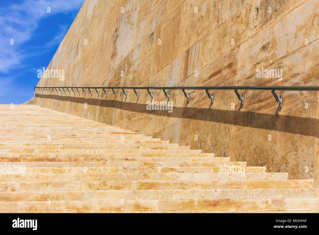 Stone stairs and stone wall with metal rail in the historic center of ...
