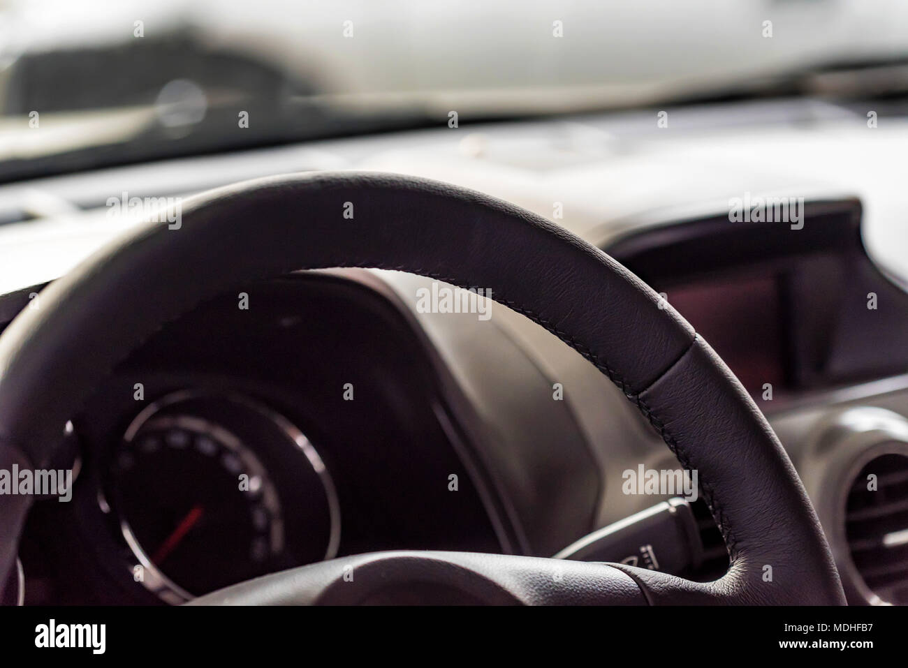 Steering wheel of modern car close Stock Photo - Alamy