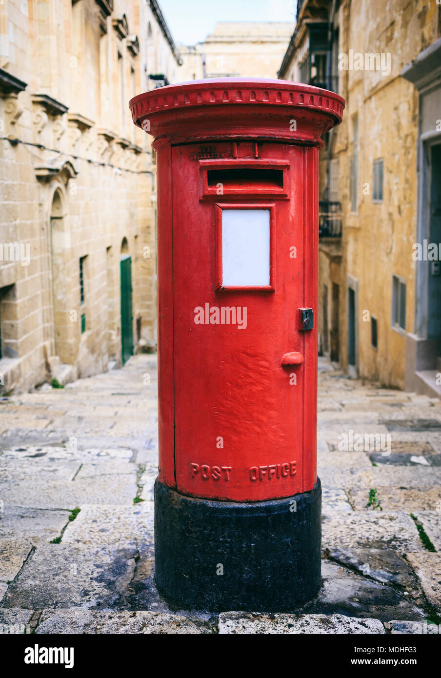 Red british post box in a city street hi-res stock photography and ...