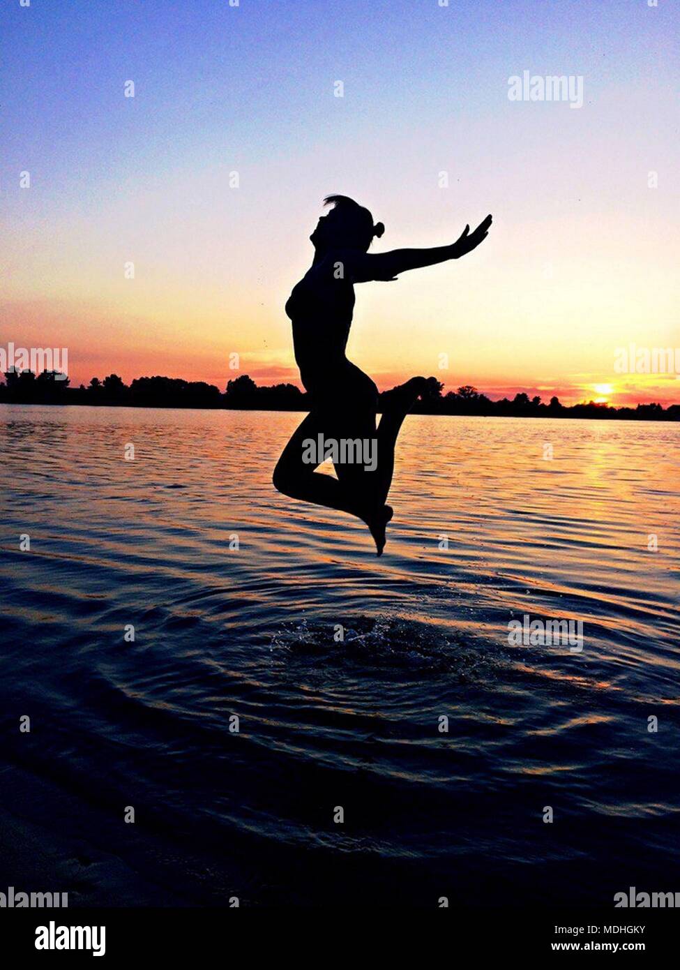 Girl jumping water hi-res stock photography and images - Alamy