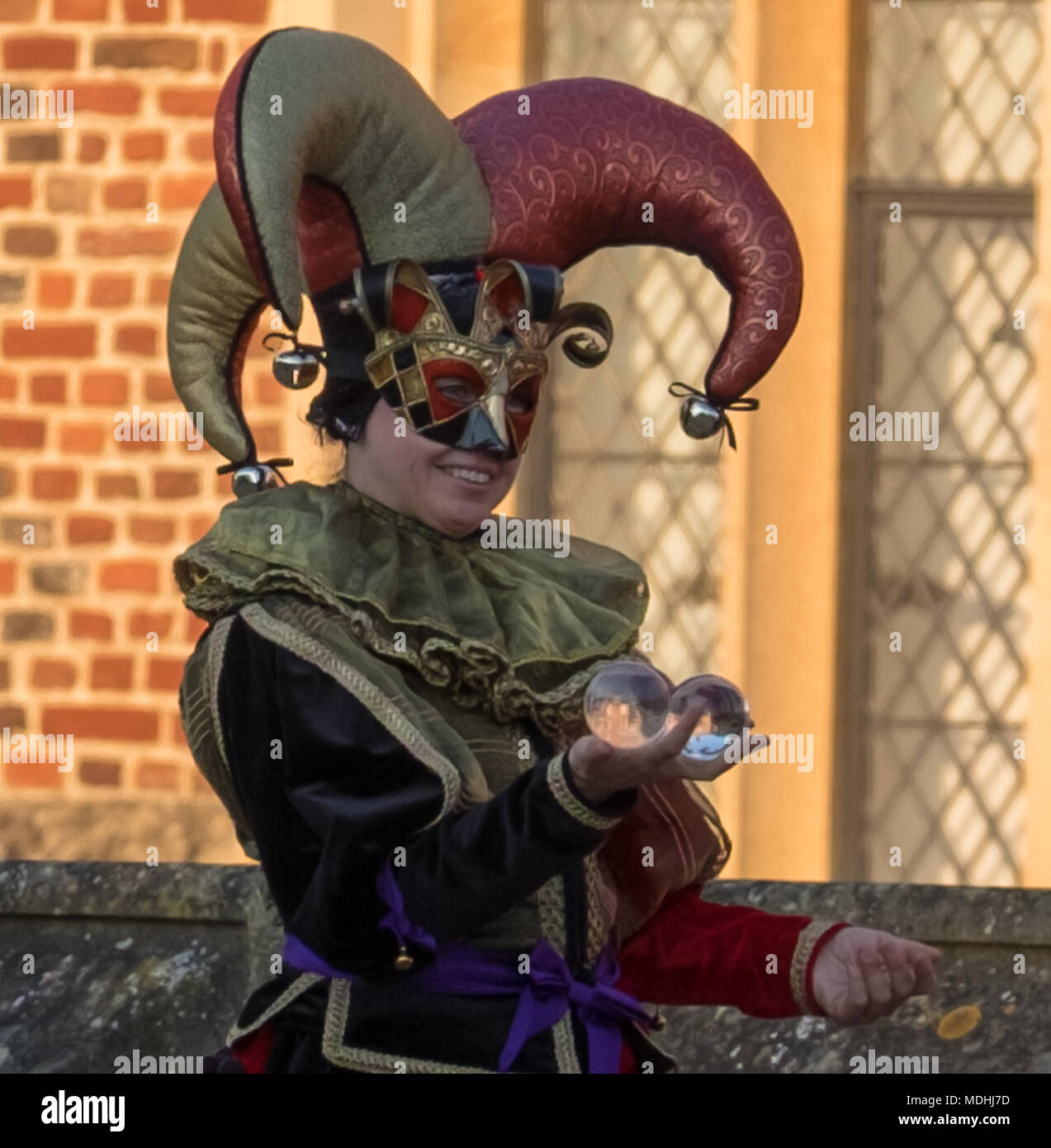 jester as a welcome to Hampton Court Party Stock Photo - Alamy