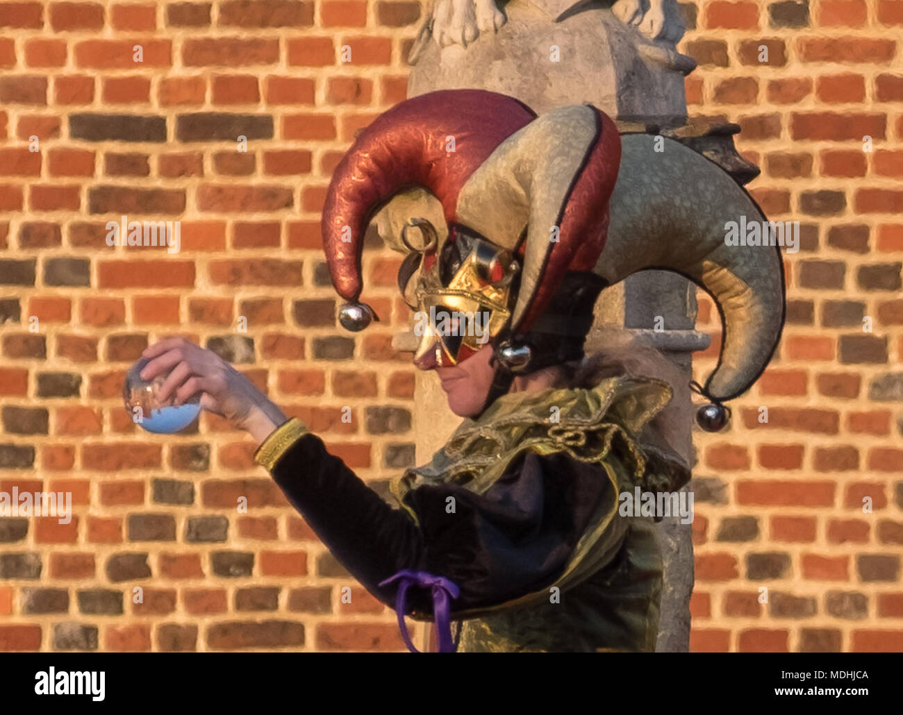 jester as a welcome to Hampton Court Party Stock Photo - Alamy