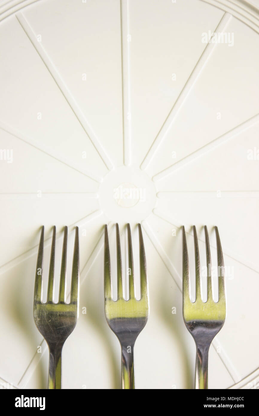 three fork pointing in the same direction on white background Stock ...