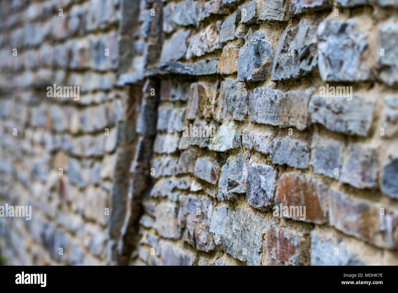 abstraction wall fence built of natural stone background Stock Photo ...