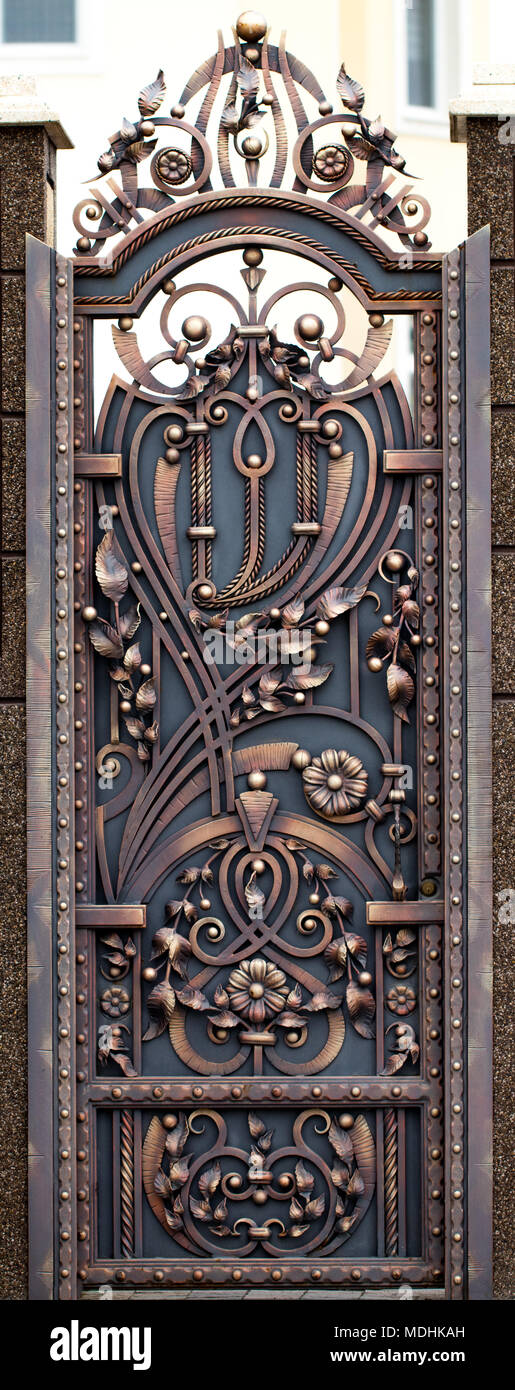 door decoration with ornate wrought-iron elements, close up Stock Photo ...