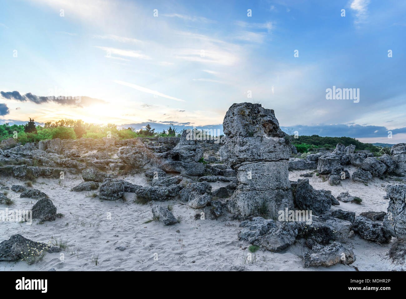 Beautiful landscape of abstract stones on a hill at sunset Stock Photo ...