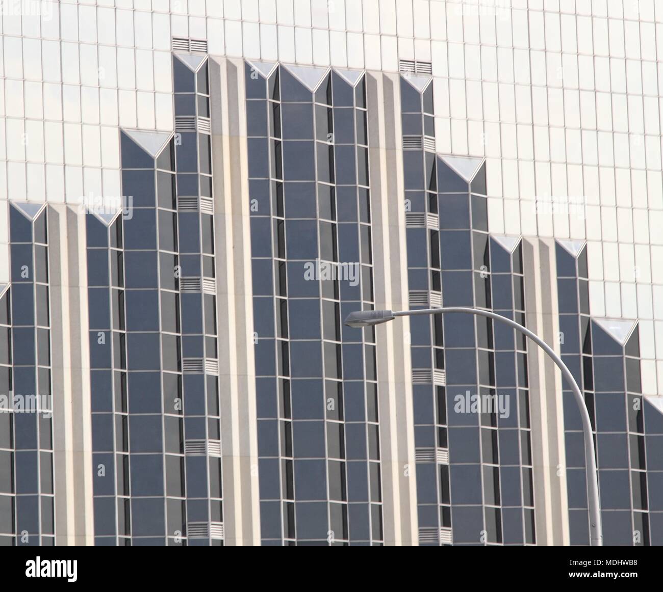 Pattern of embedded building built into mirrored structure Stock Photo ...