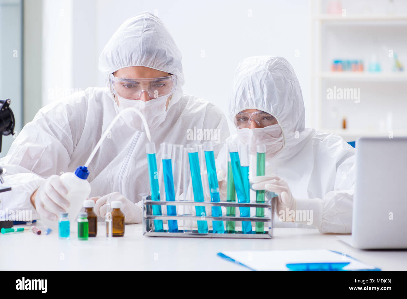 Two scientists working in the chemical lab Stock Photo - Alamy