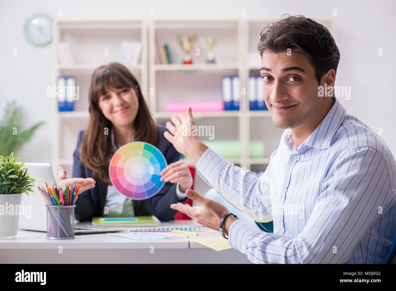 People discussing new design of project Stock Photo - Alamy