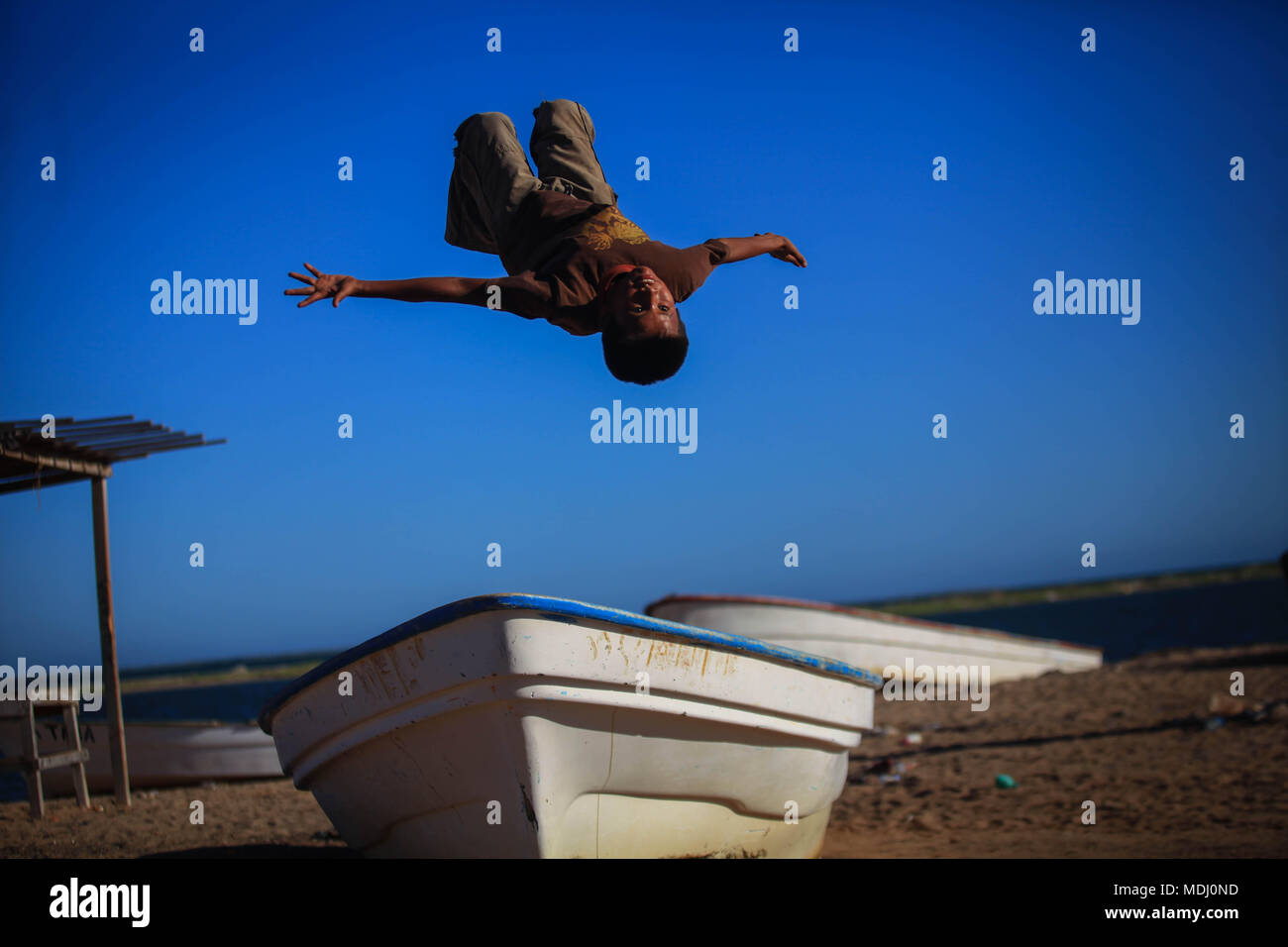 child of indigenous tribe Seri or Conca'ac, Concaac, jumps from a ...