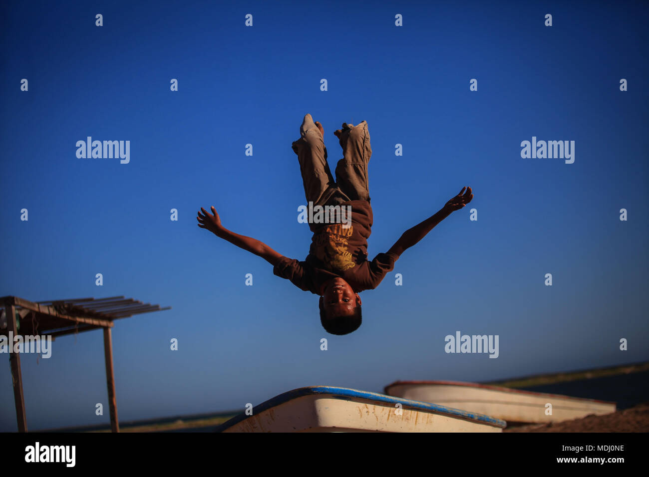 child of indigenous tribe Seri or Conca'ac, Concaac, jumps from a ...
