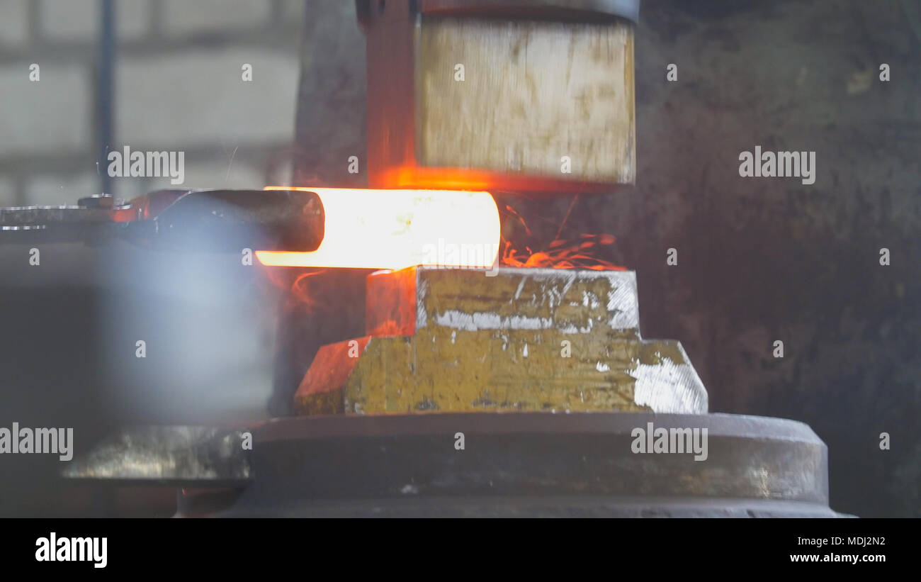 Blacksmith with hammer in forge creating steel knife Stock Photo - Alamy