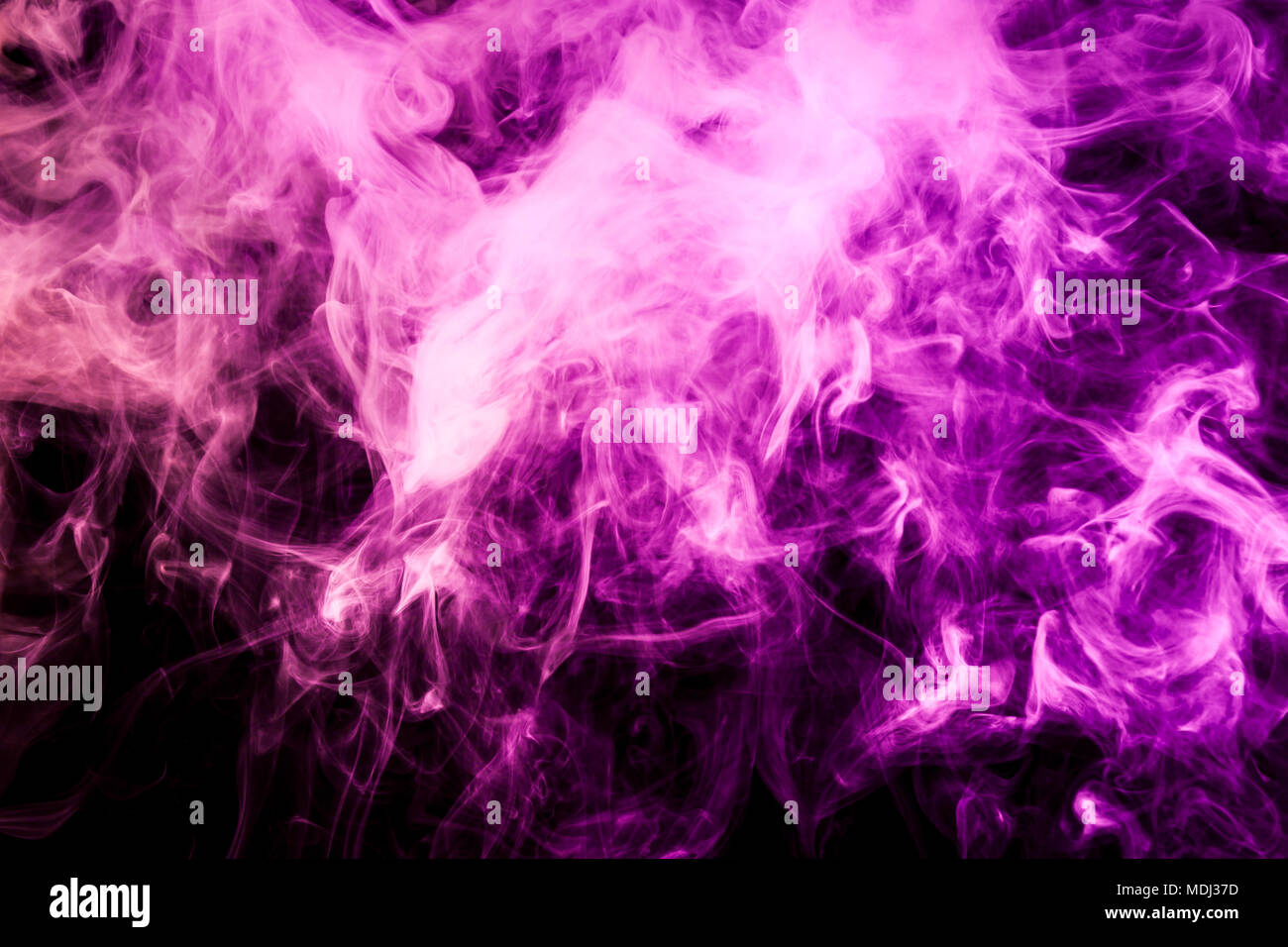 Colorful pink and red smoke on a black isolated background. Background ...