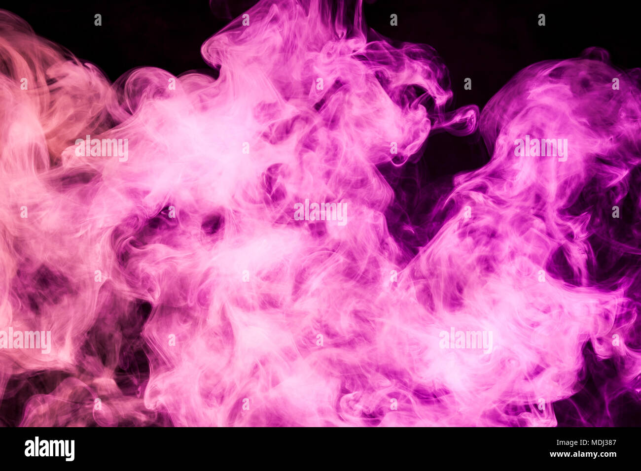 Colorful pink and red smoke on a black isolated background. Background ...