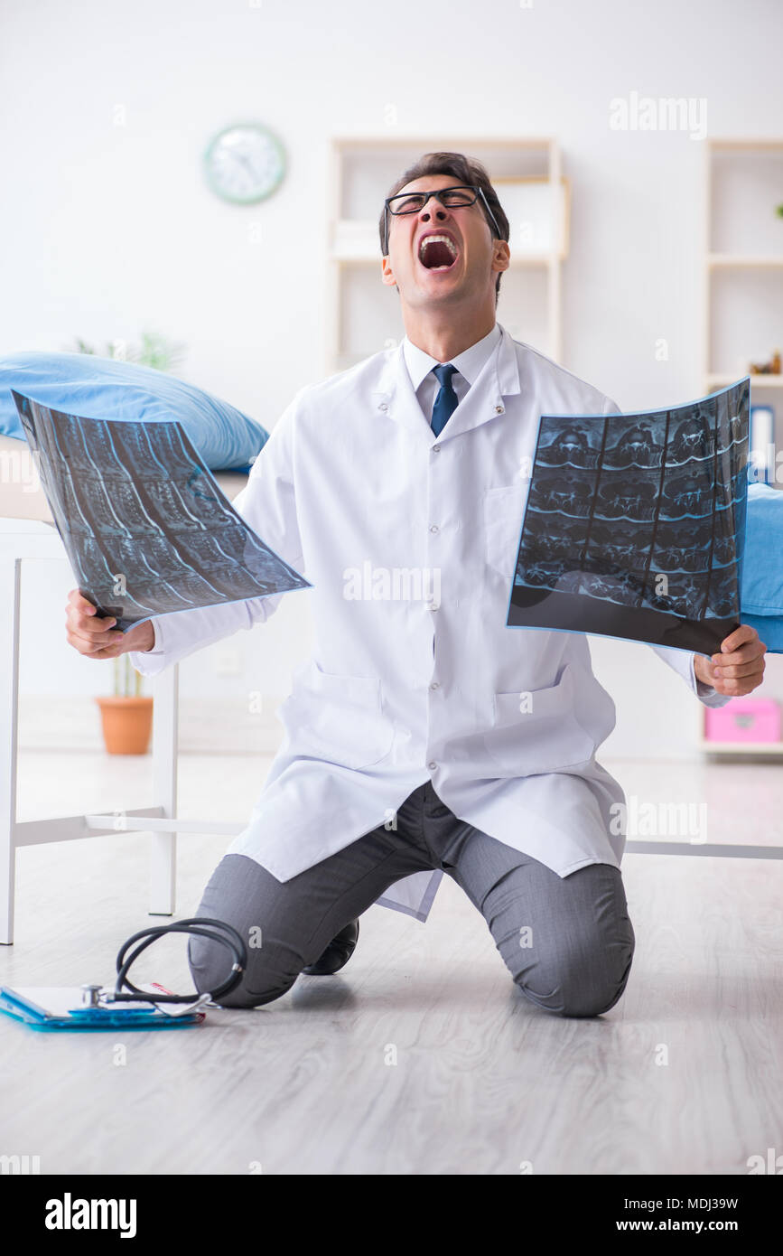 Doctor sitting on the floor in hospital Stock Photo - Alamy