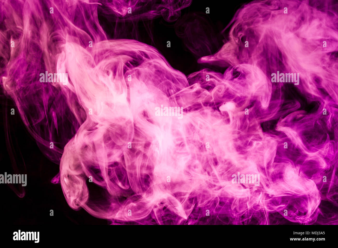 Colorful pink and red smoke on a black isolated background. Background ...