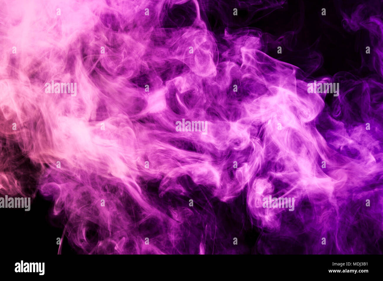 Colorful pink and red smoke on a black isolated background. Background ...