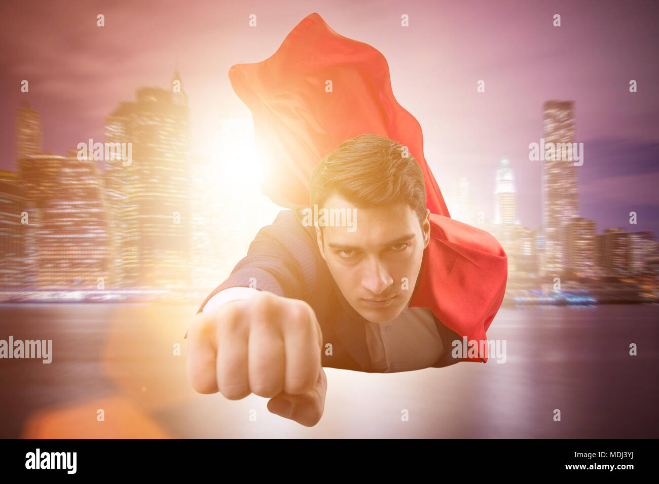 Flying super hero over the city Stock Photo - Alamy