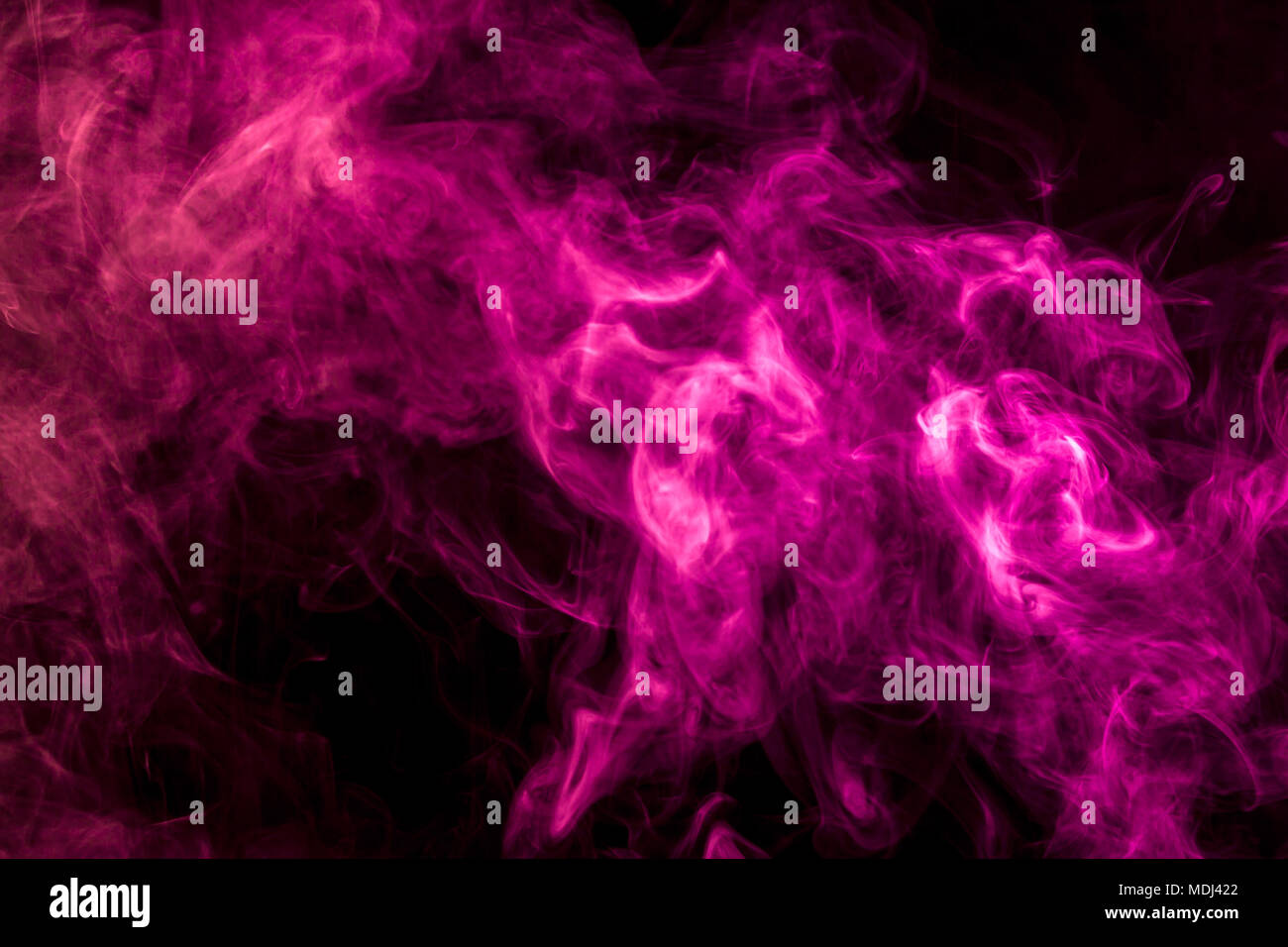 Pink and red cloud of smoke of black isolated background. Background ...