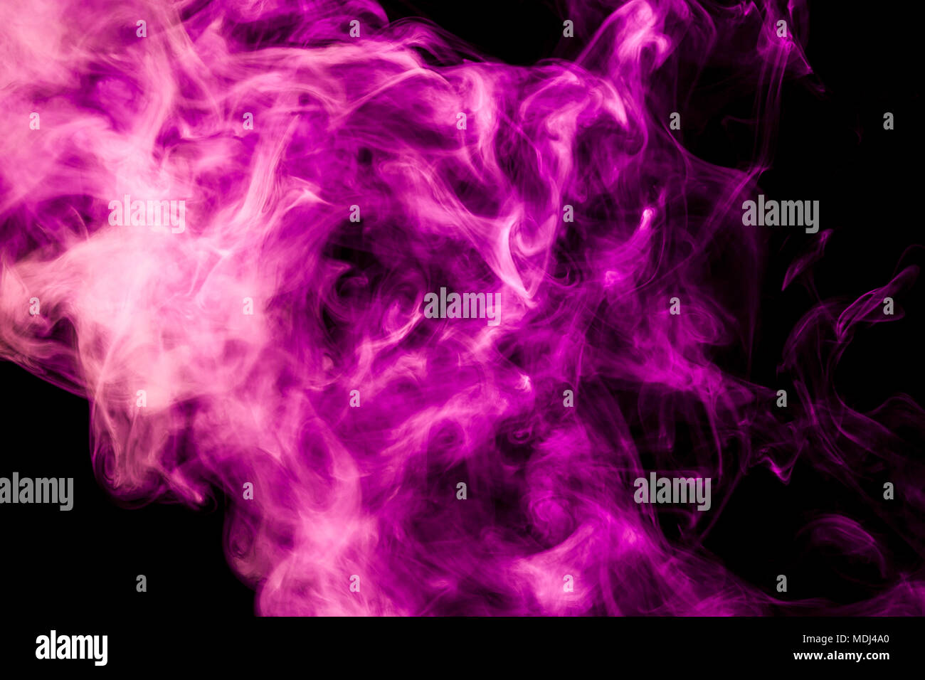 Colorful pink and red smoke on a black isolated background. Background ...