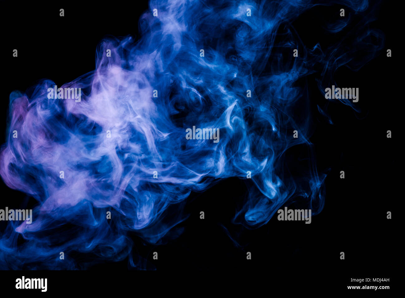 Colorful blue smoke on a black isolated background. Background from the ...