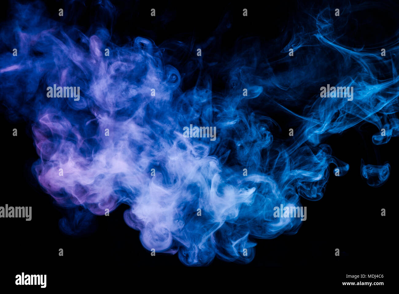 Colorful blue smoke on a black isolated background. Background from the ...