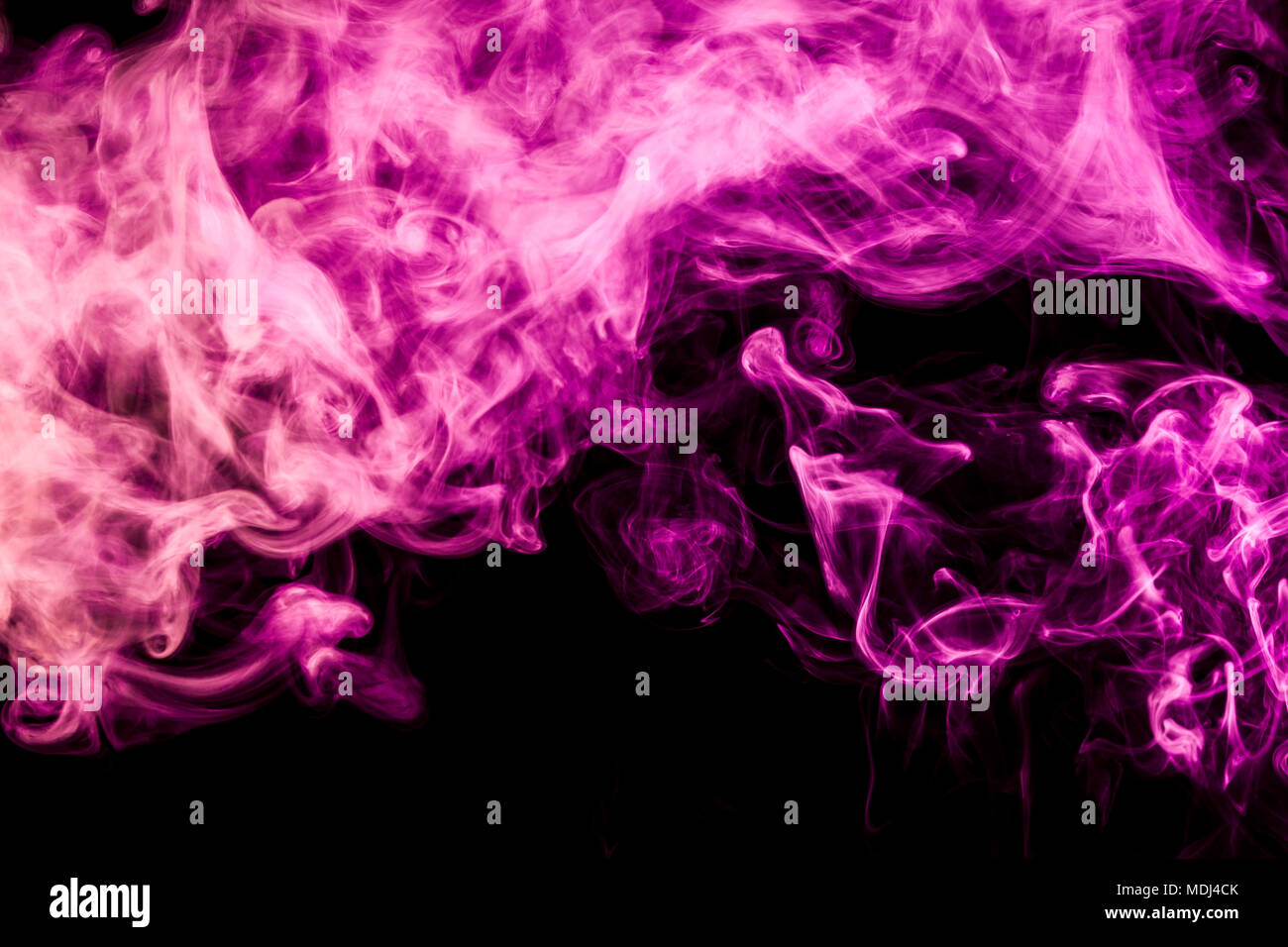 Colorful pink and red smoke on a black isolated background. Background ...