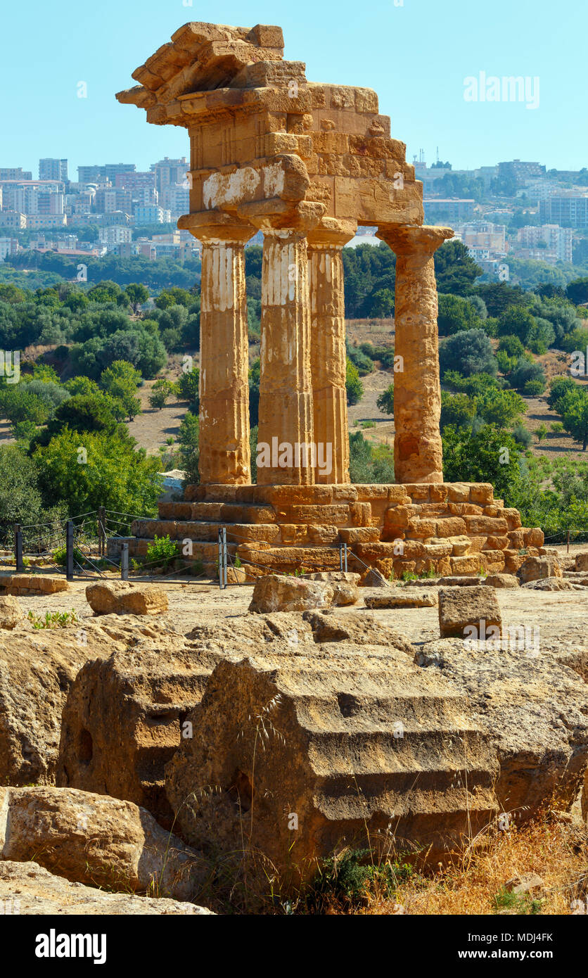 Temple of Dioscuri (Castor and Pollux) with Agrigento town in the ...