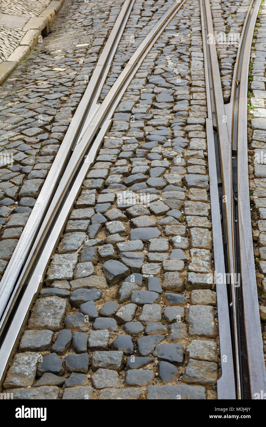 Lisbon high slope street with rail fork Stock Photo - Alamy