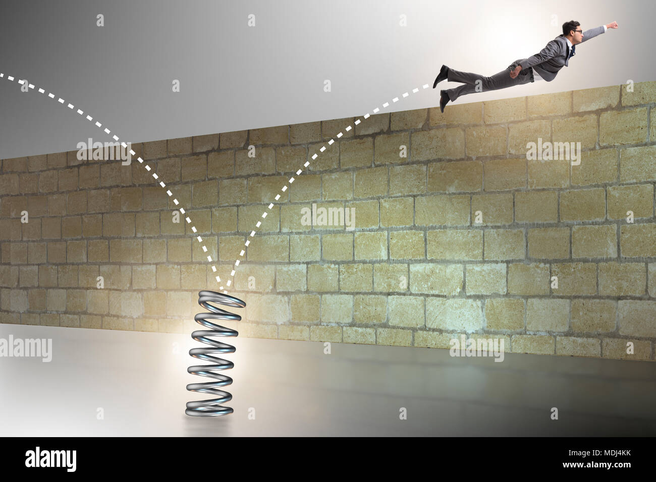 Man jumping over stone wall hi-res stock photography and images - Alamy