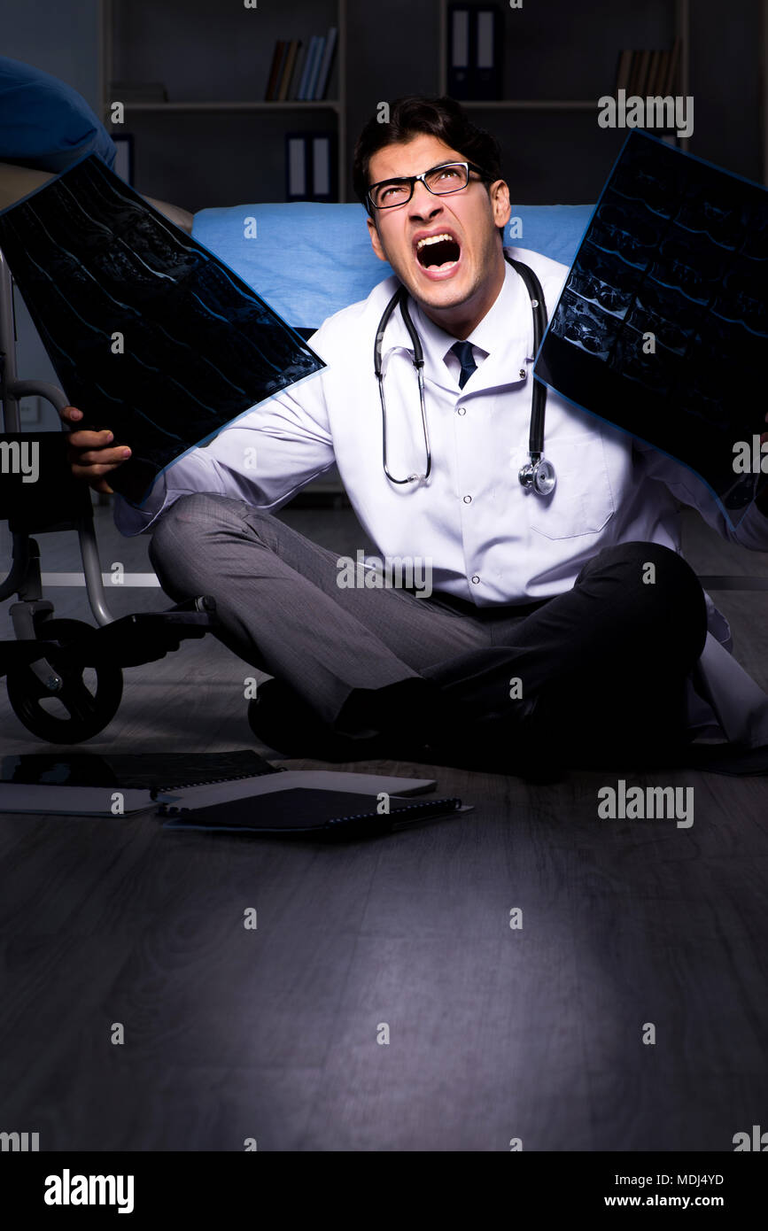 Doctor working night shift in hospital after long hours Stock Photo - Alamy