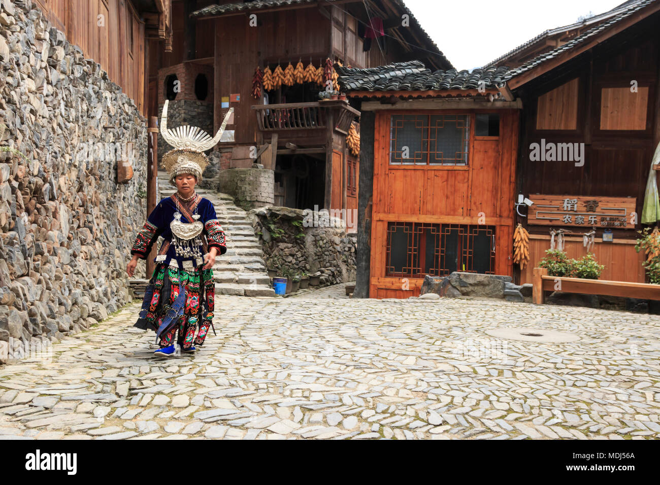 Langde, China - March 27, 2018: Miao woman wearing the traditional Miao ...