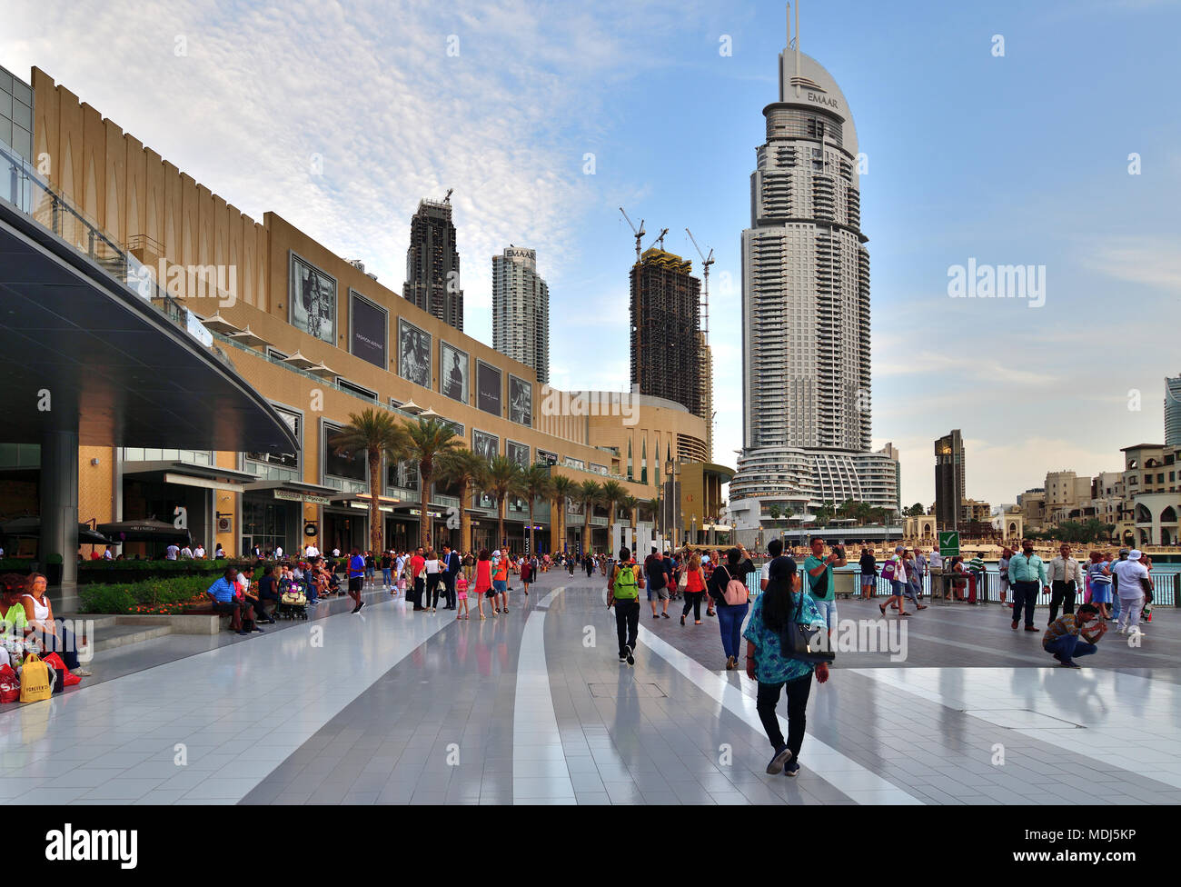 Dubai, UAE - April 8. 2018. Tourists on square at fountain in front of ...