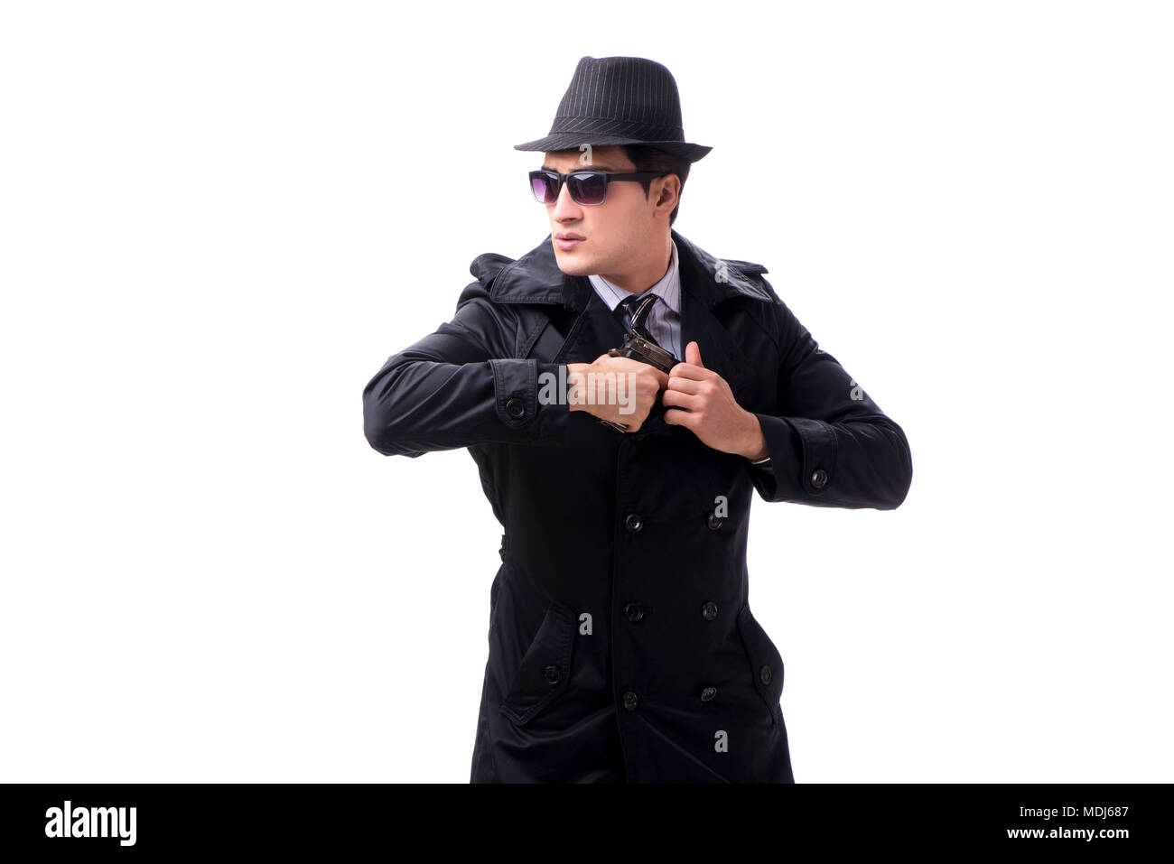 Man spy with handgun isolated on white background Stock Photo - Alamy