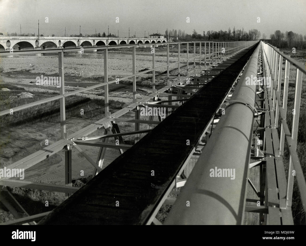 Methane pipeline over the Taro river bridge, Italy 1958 Stock Photo - Alamy