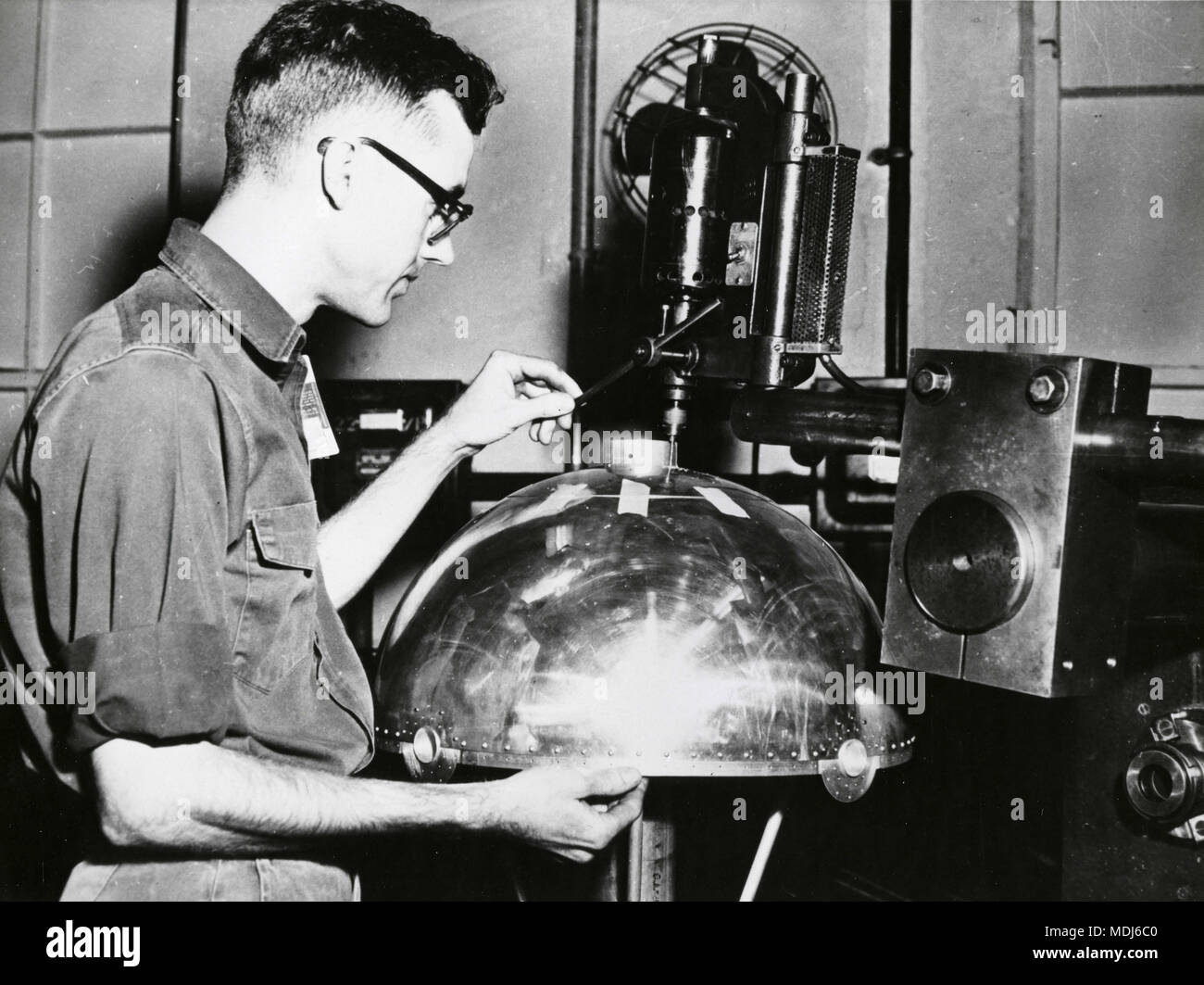Scientist building space instruments, 1950s Stock Photo - Alamy