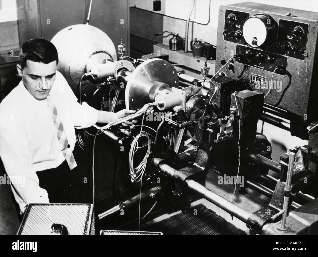 Scientist building space instruments, 1950s Stock Photo - Alamy