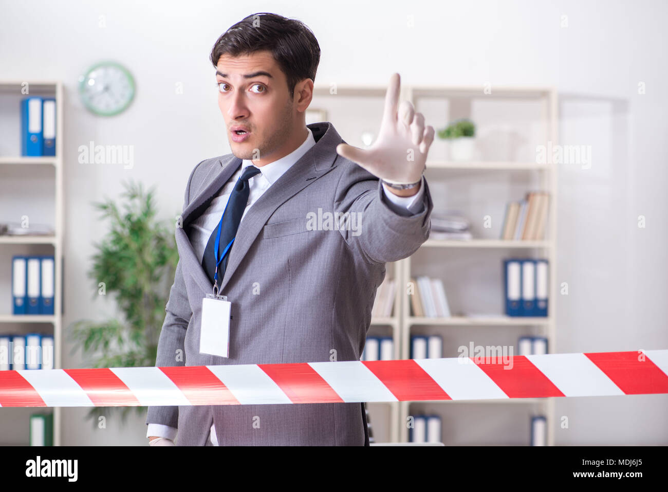 Forensics investigator at the scene of office crime Stock Photo - Alamy