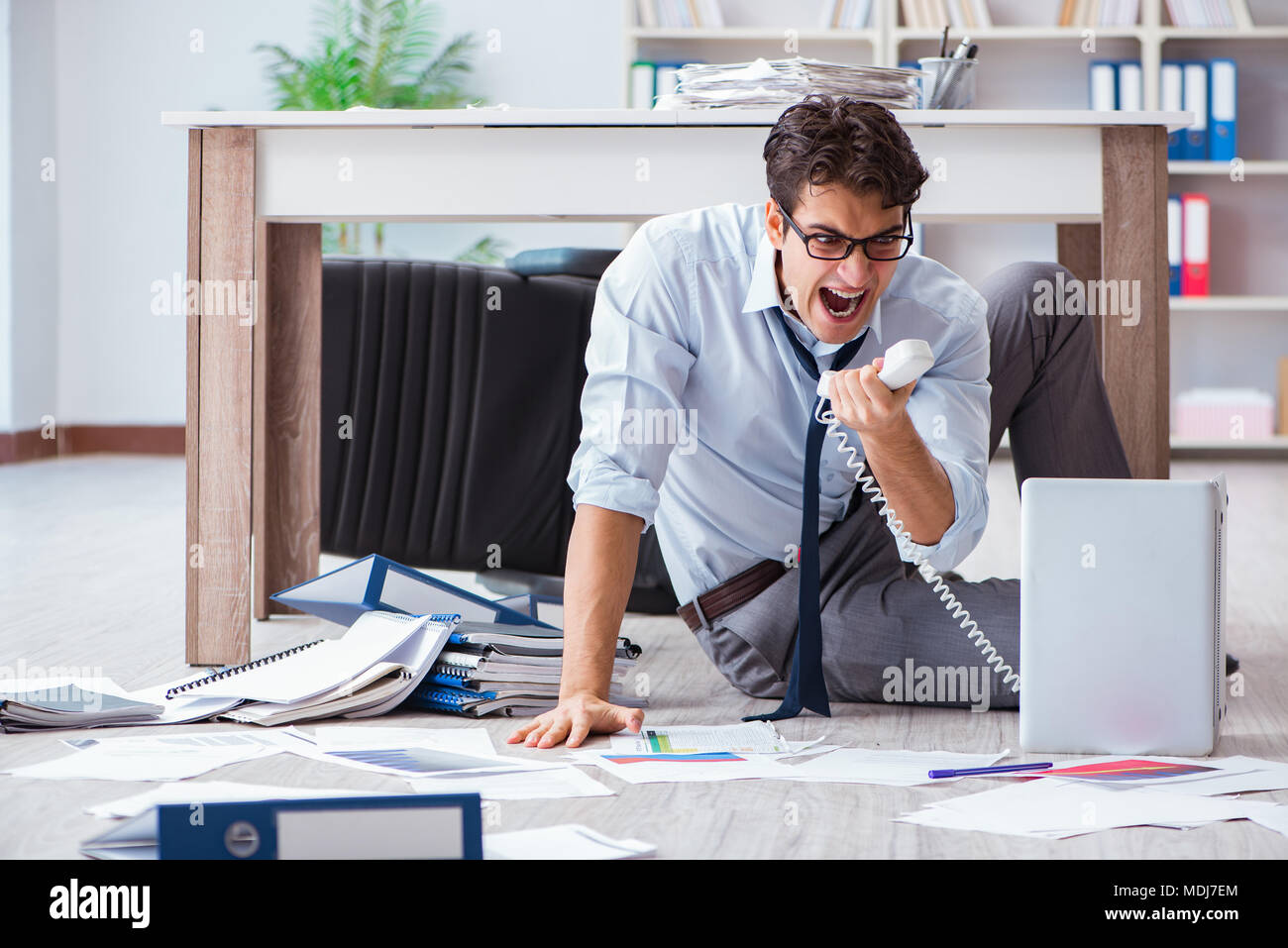 Bankrupt businessman angry in the office floor Stock Photo - Alamy