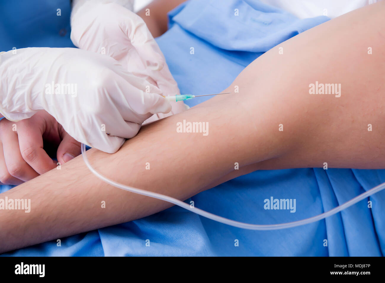 Doctor doing medical injection in hospital room Stock Photo - Alamy