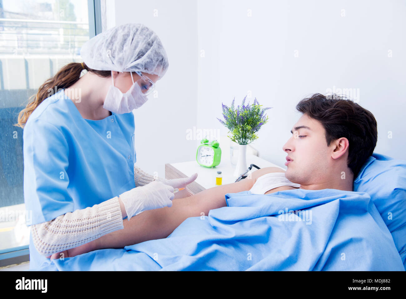 Doctor doing medical injection in hospital room Stock Photo - Alamy